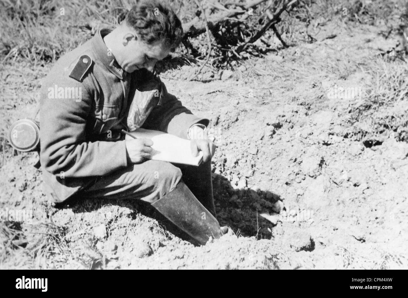 A German soldier writes a message, 1940 Stock Photo - Alamy