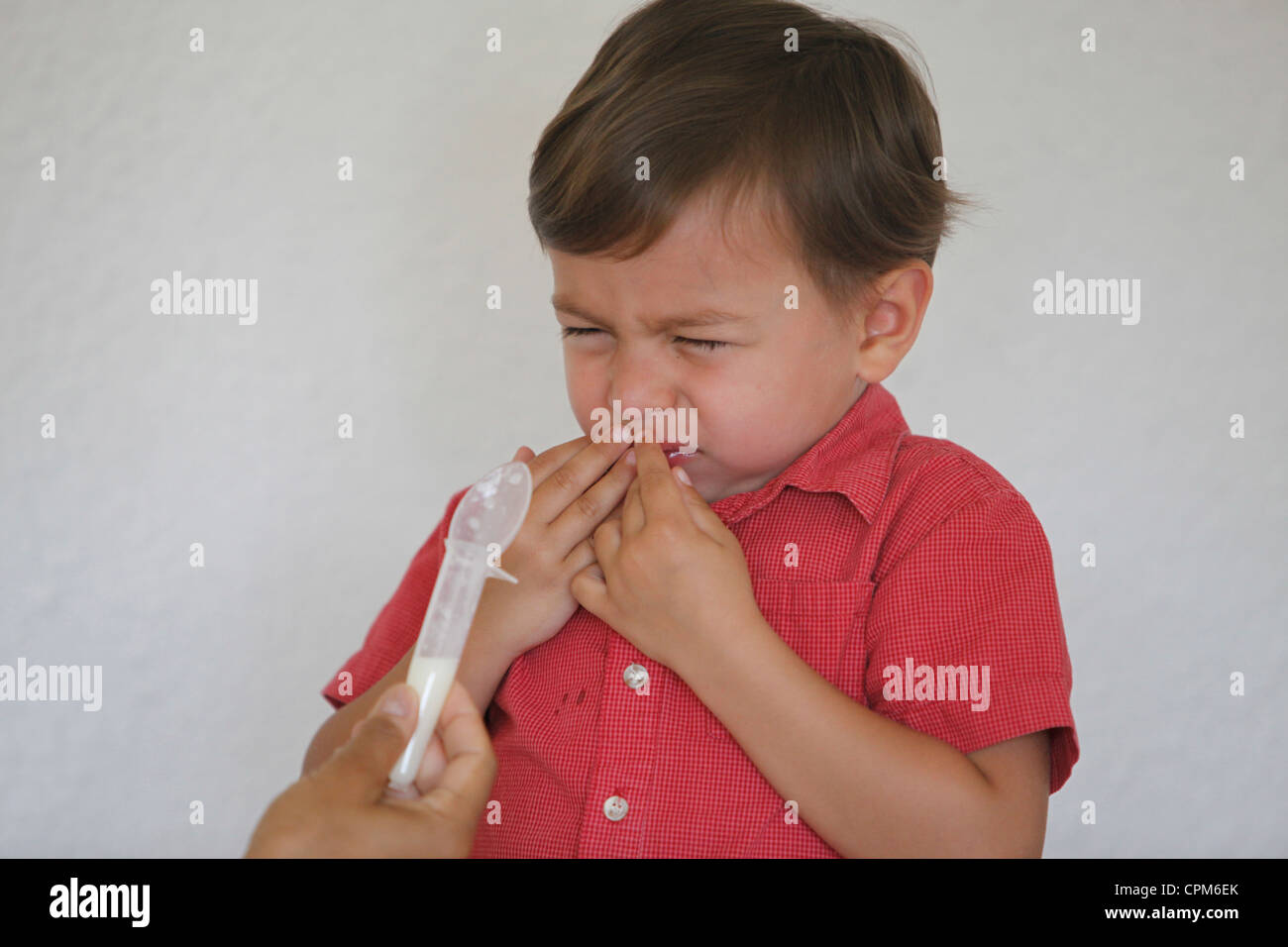CHILD TAKING MEDICATION Stock Photo - Alamy
