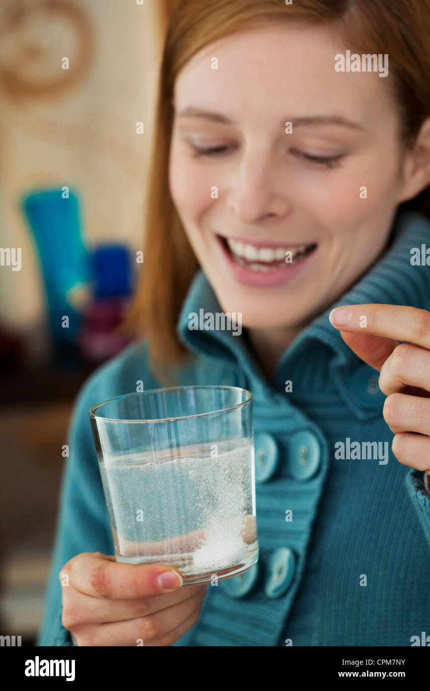 WOMAN WITH ASPIRIN Stock Photo - Alamy