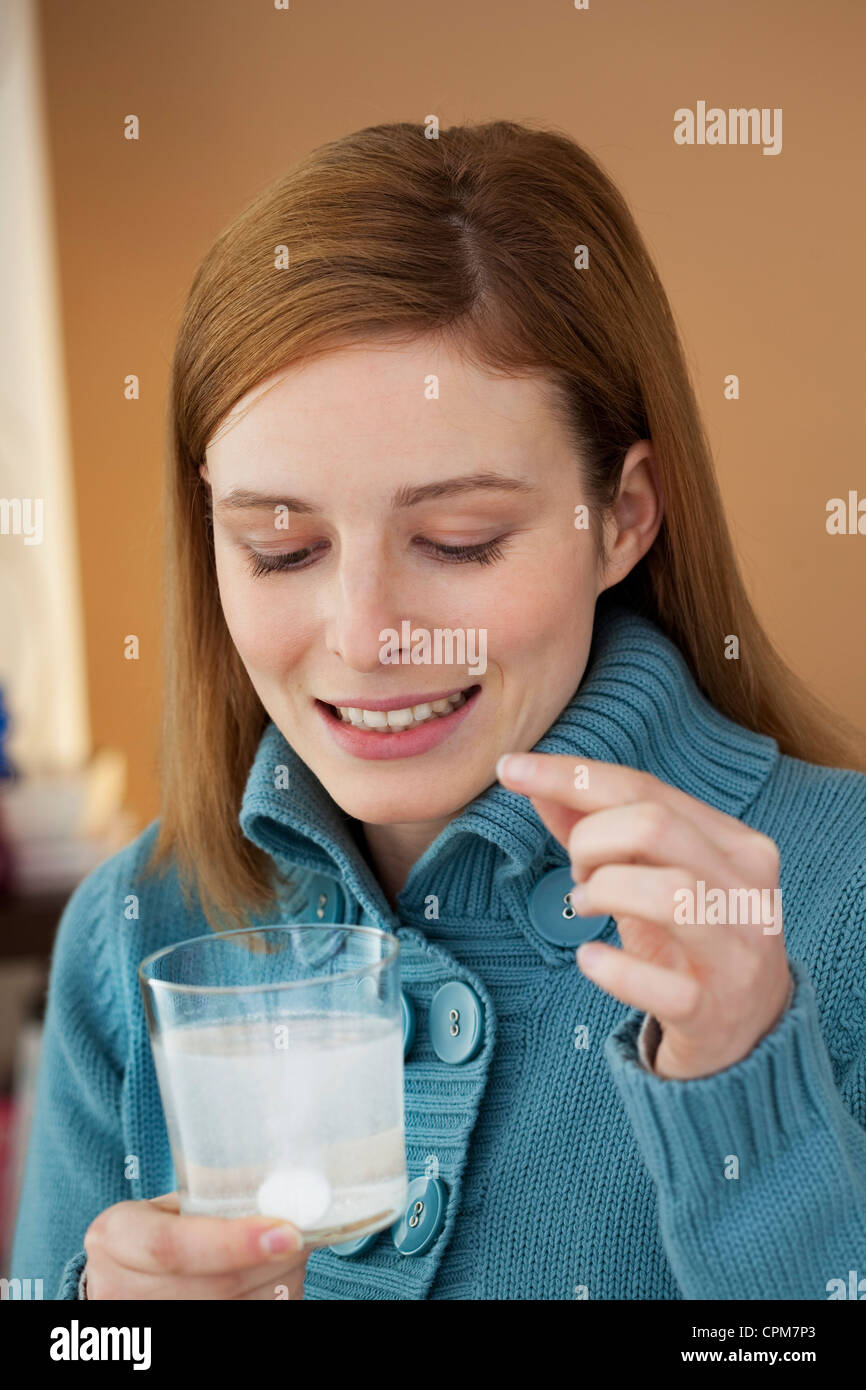 WOMAN WITH ASPIRIN Stock Photo - Alamy