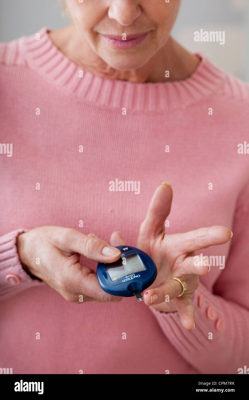 TEST FOR DIABETES ELDERLY PERSON Stock Photo - Alamy