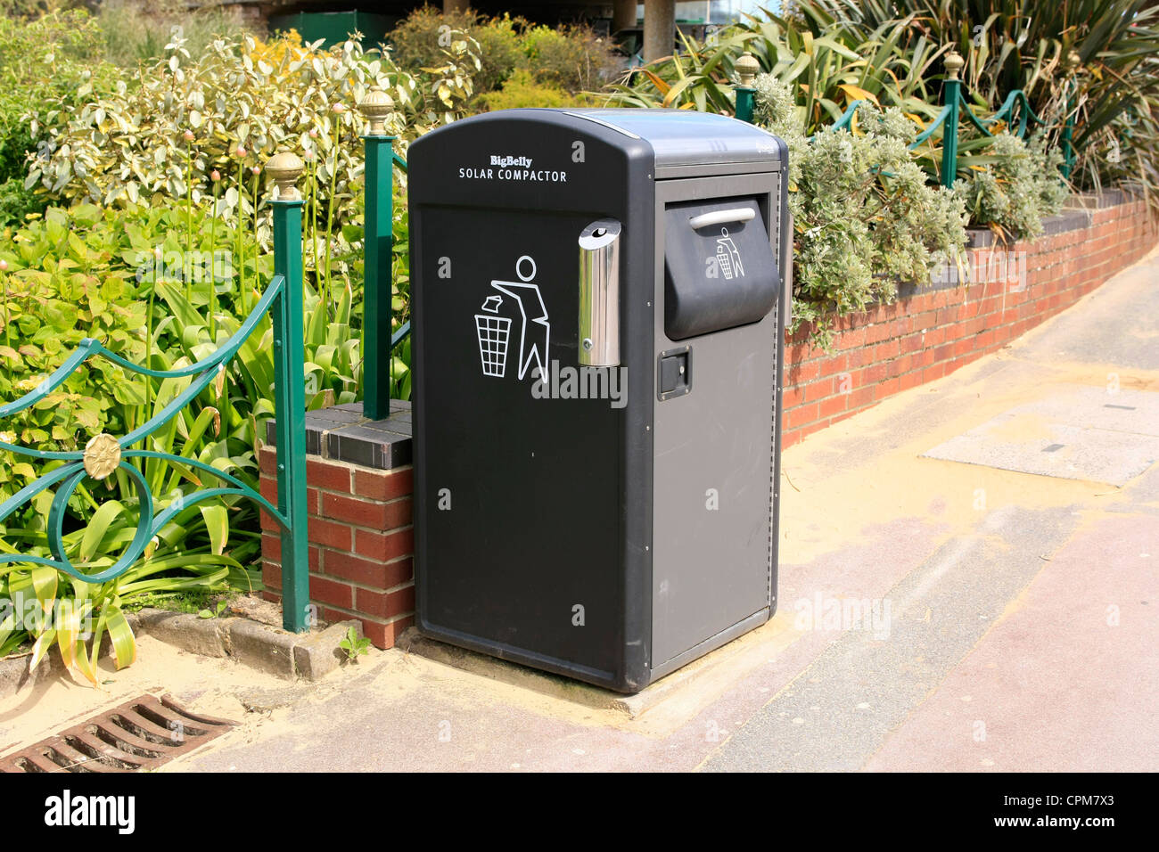 A public waste bin with a built-in solar compactor Stock Photo - Alamy