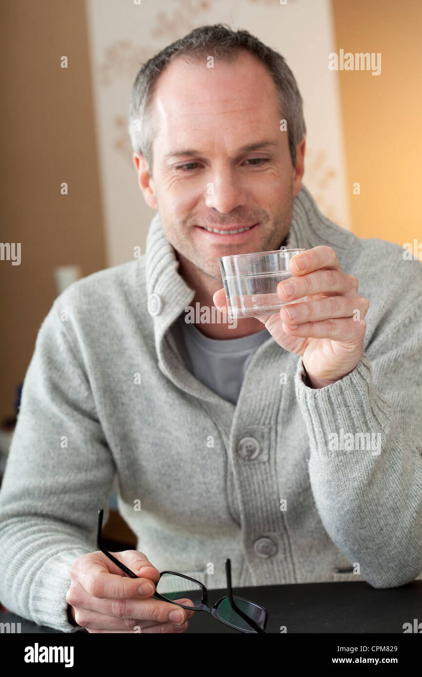 MAN WITH COLD DRINK Stock Photo - Alamy