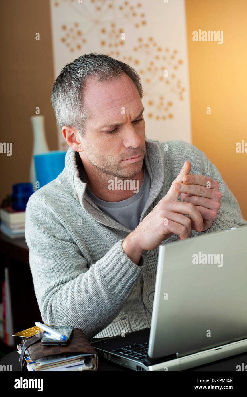 MAN WITH PAINFUL HAND Stock Photo - Alamy