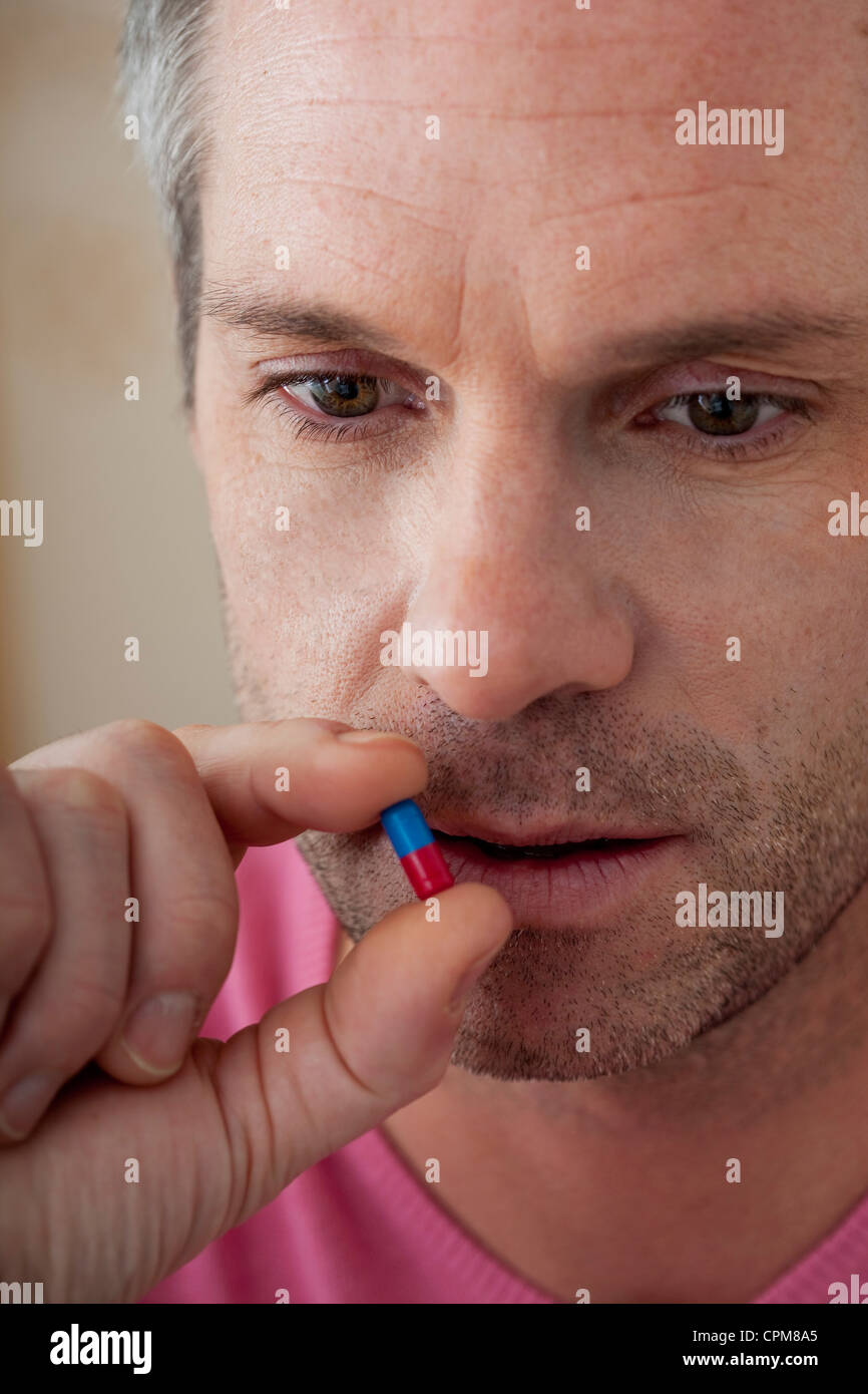 MAN TAKING MEDICATION Stock Photo - Alamy