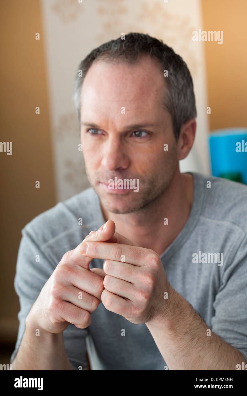 MAN WITH PAINFUL HAND Stock Photo - Alamy