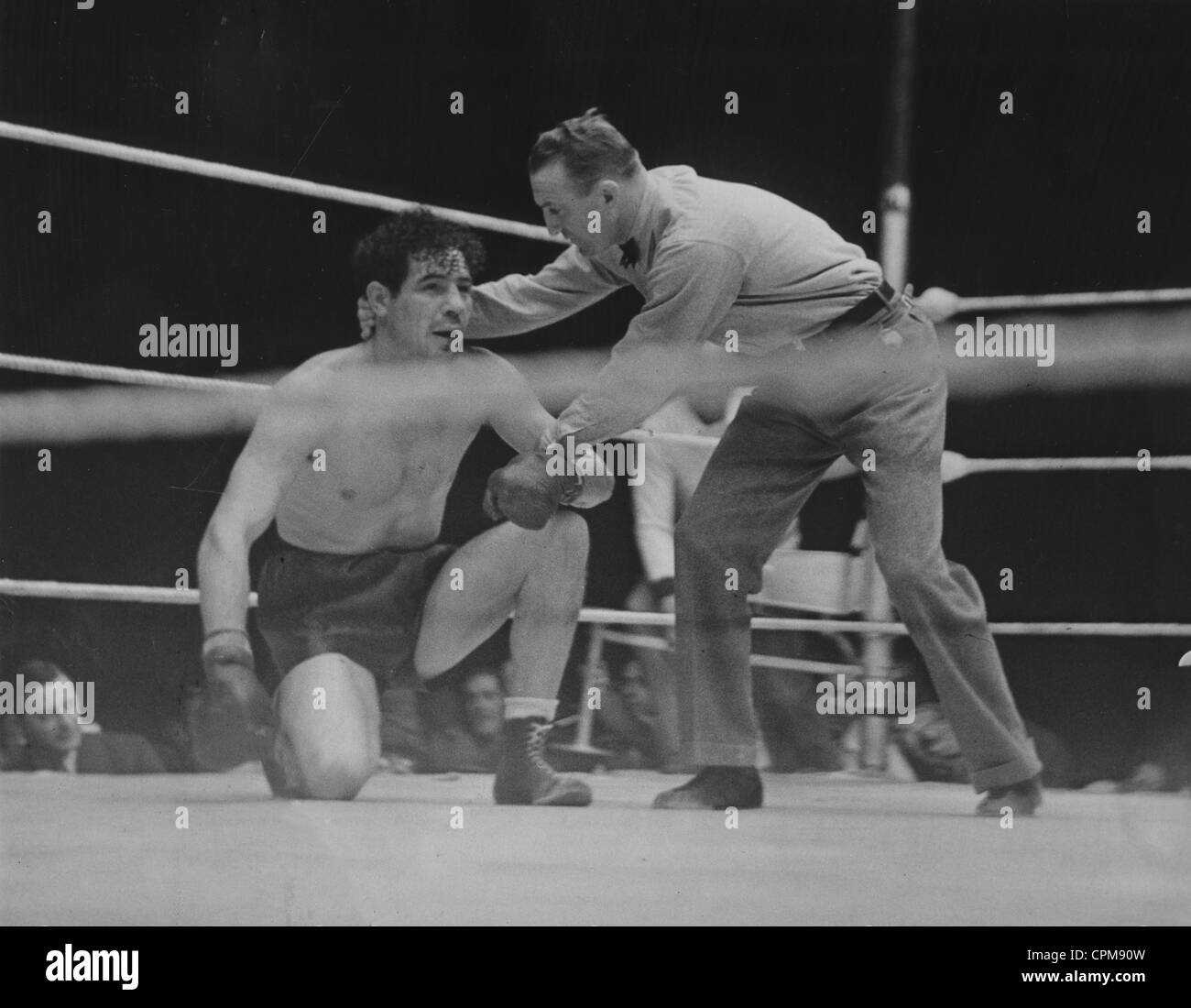 Max Baer on the ground, 1935 Stock Photo - Alamy