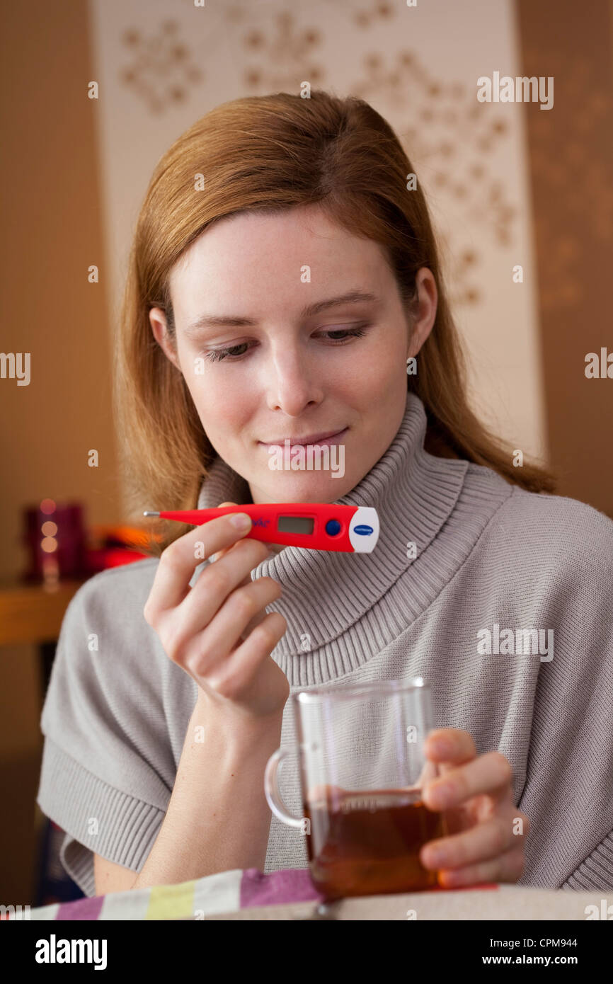 WOMAN WITH FEVER Stock Photo - Alamy