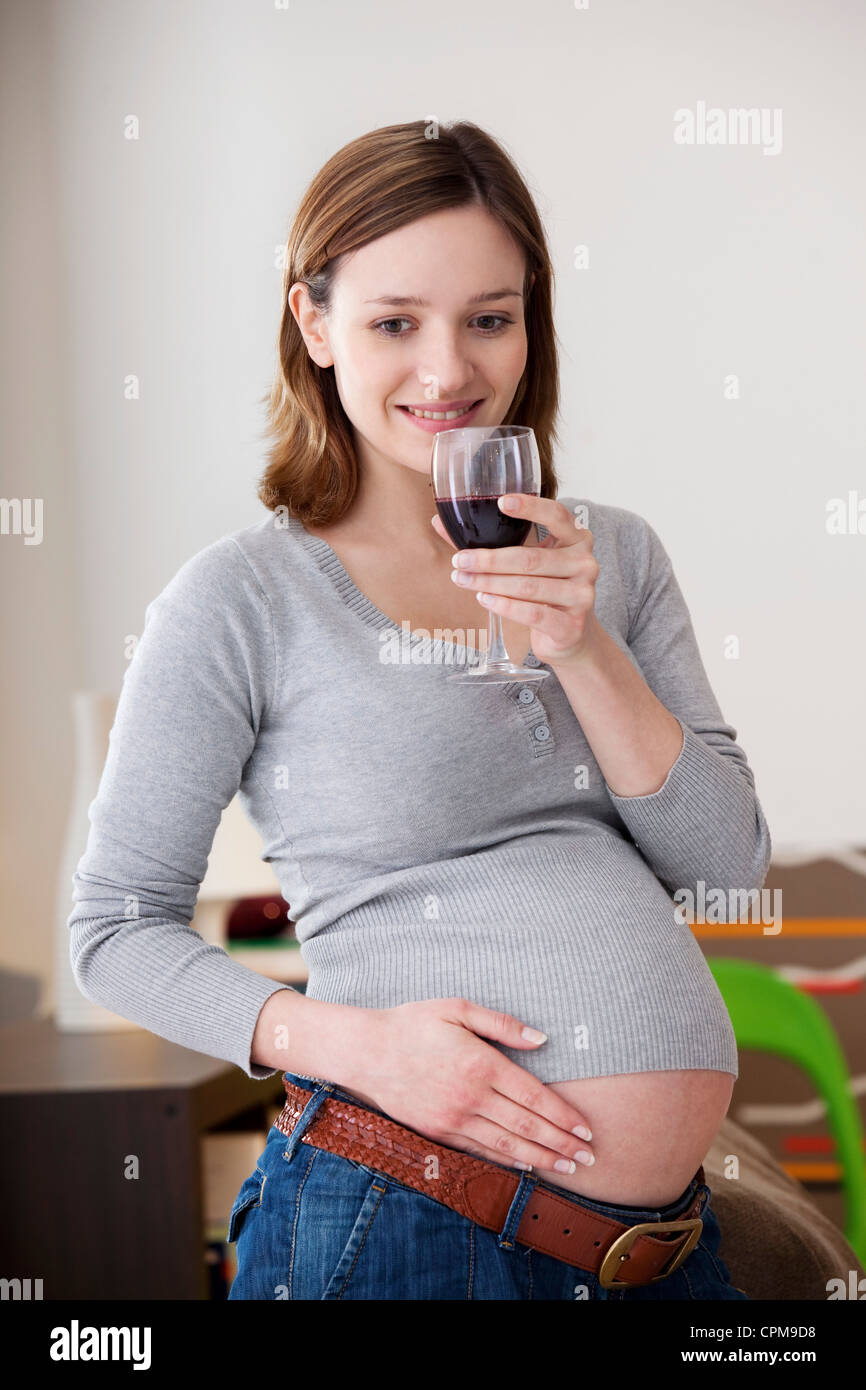 PREGNANT WOMAN DRINKING Stock Photo - Alamy