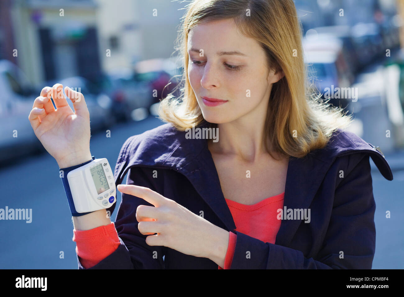 BLOOD PRESSURE, WOMAN Stock Photo - Alamy