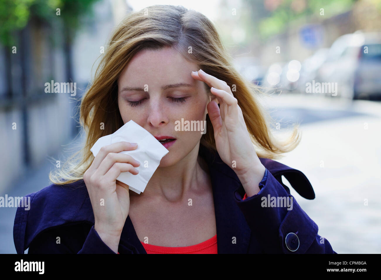 Woman sneezing outdoors hi-res stock photography and images - Alamy