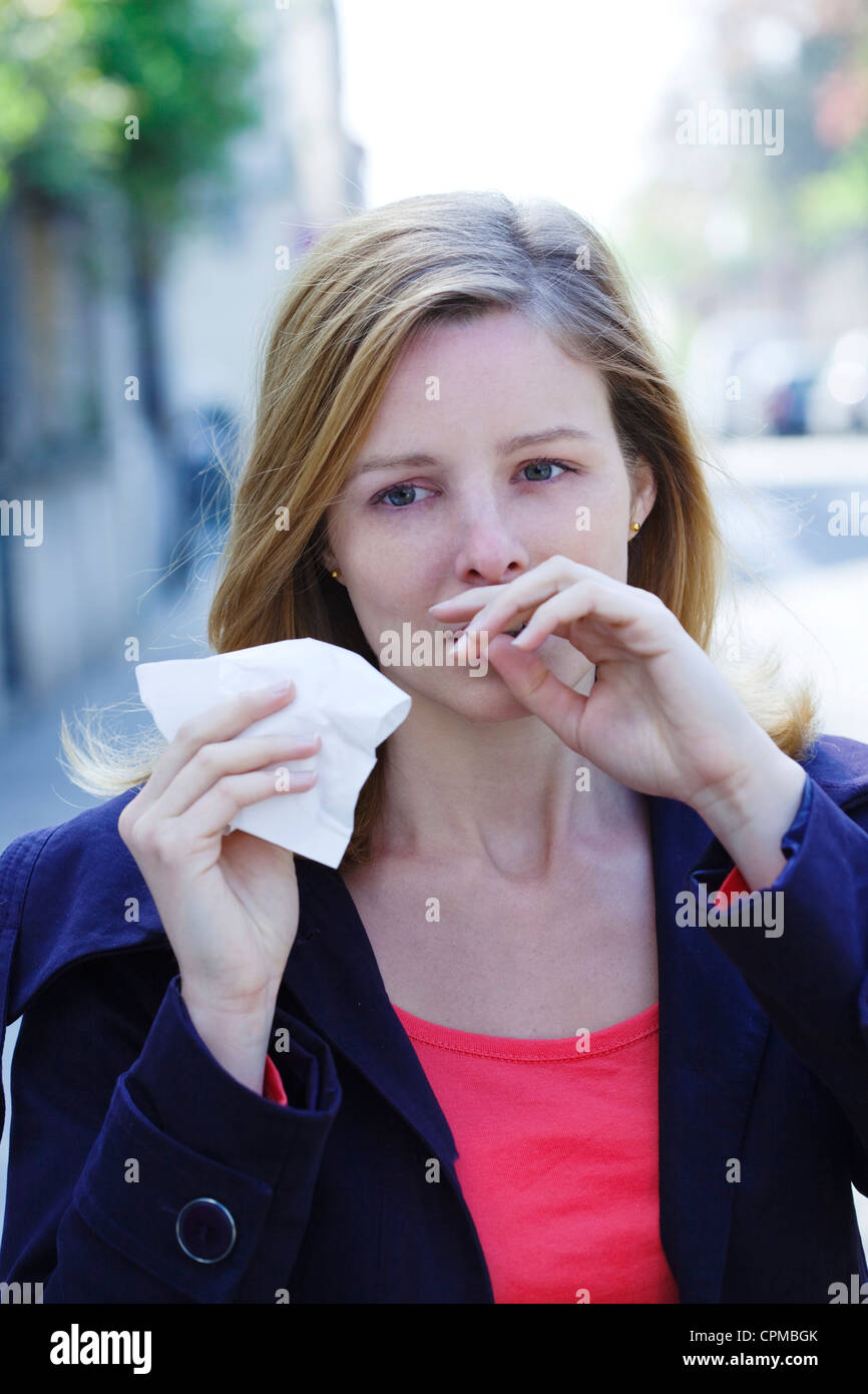 Woman sneezing outdoors hi-res stock photography and images - Alamy
