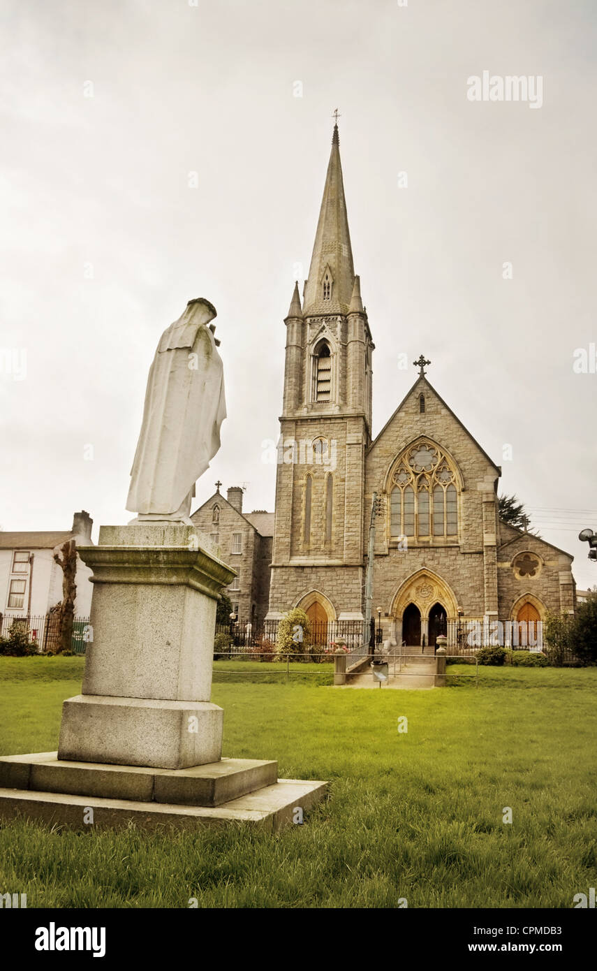 Praying to God - Statue in front of Christian church. Shot in Newry ...