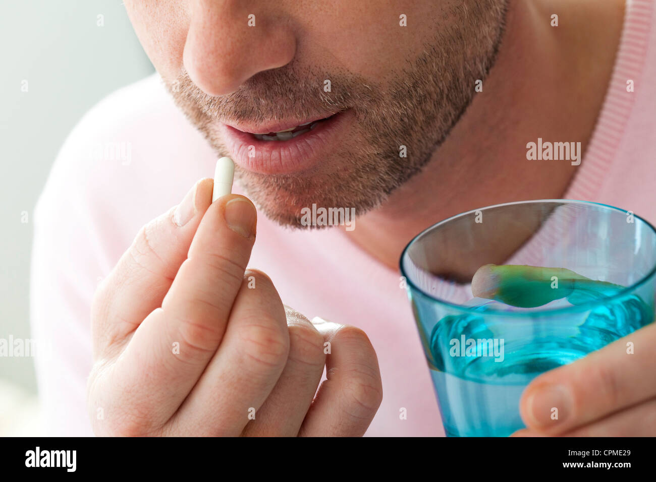 MAN TAKING MEDICATION Stock Photo - Alamy