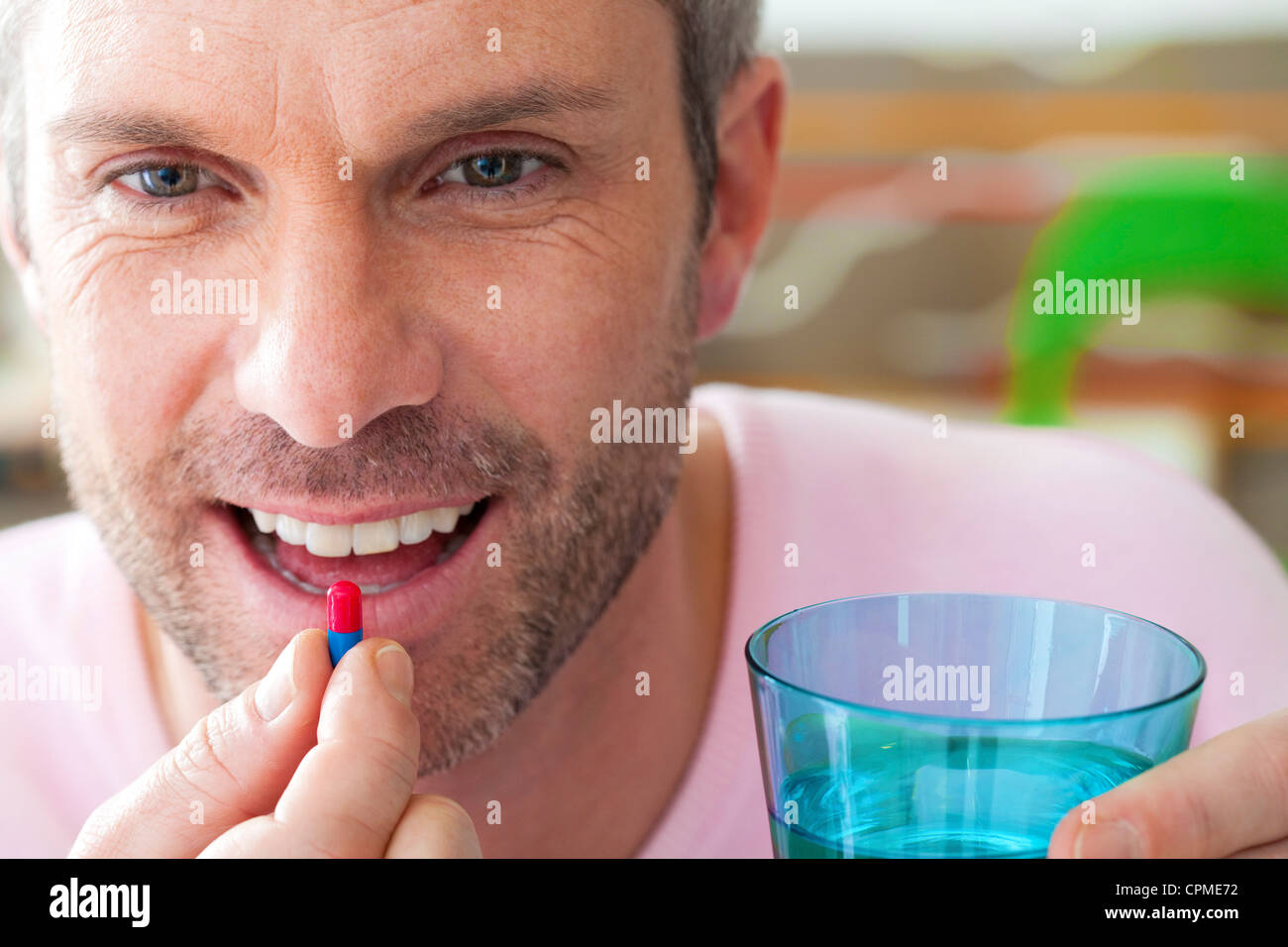 MAN TAKING MEDICATION Stock Photo - Alamy