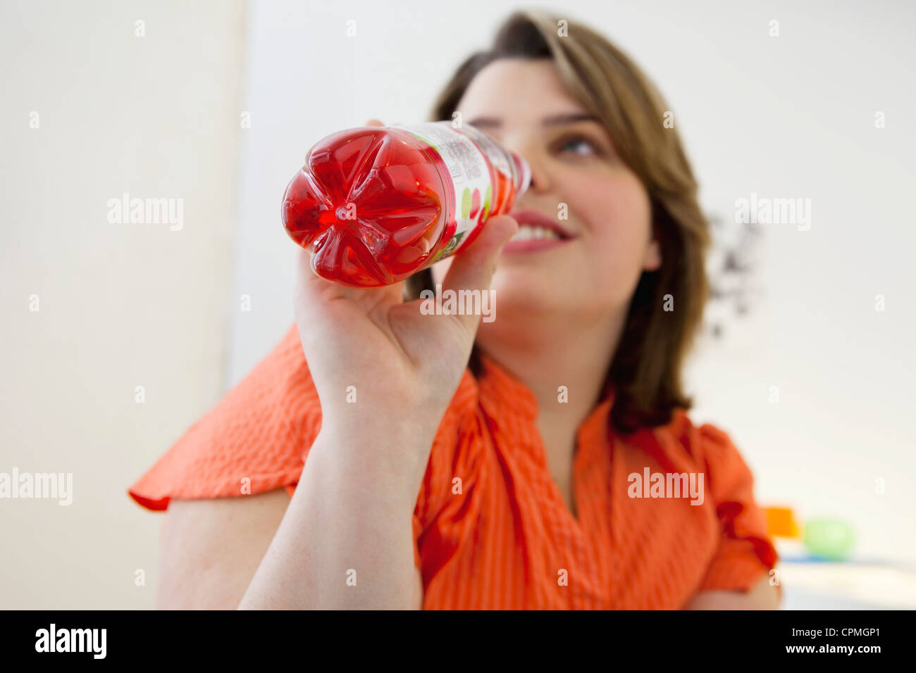 WOMAN WITH COLD DRINK Stock Photo - Alamy