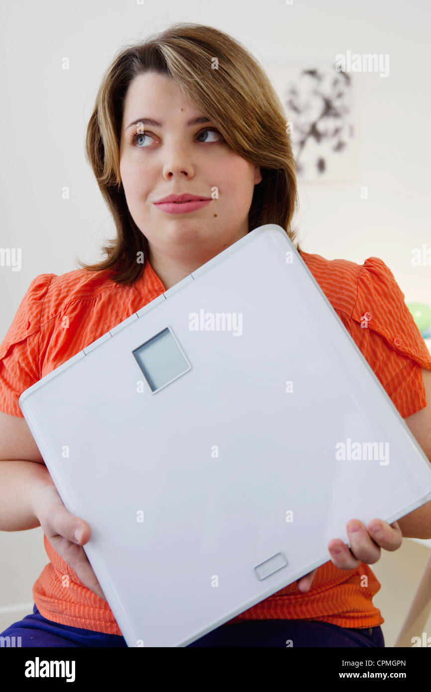 Woman scale upset hi-res stock photography and images - Alamy