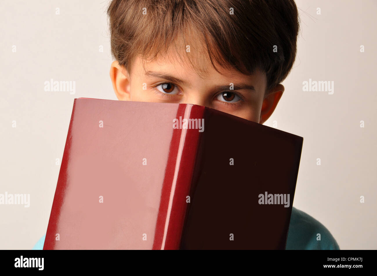 Precocious adolescent bi-racial female with pixie haircut covers half ...