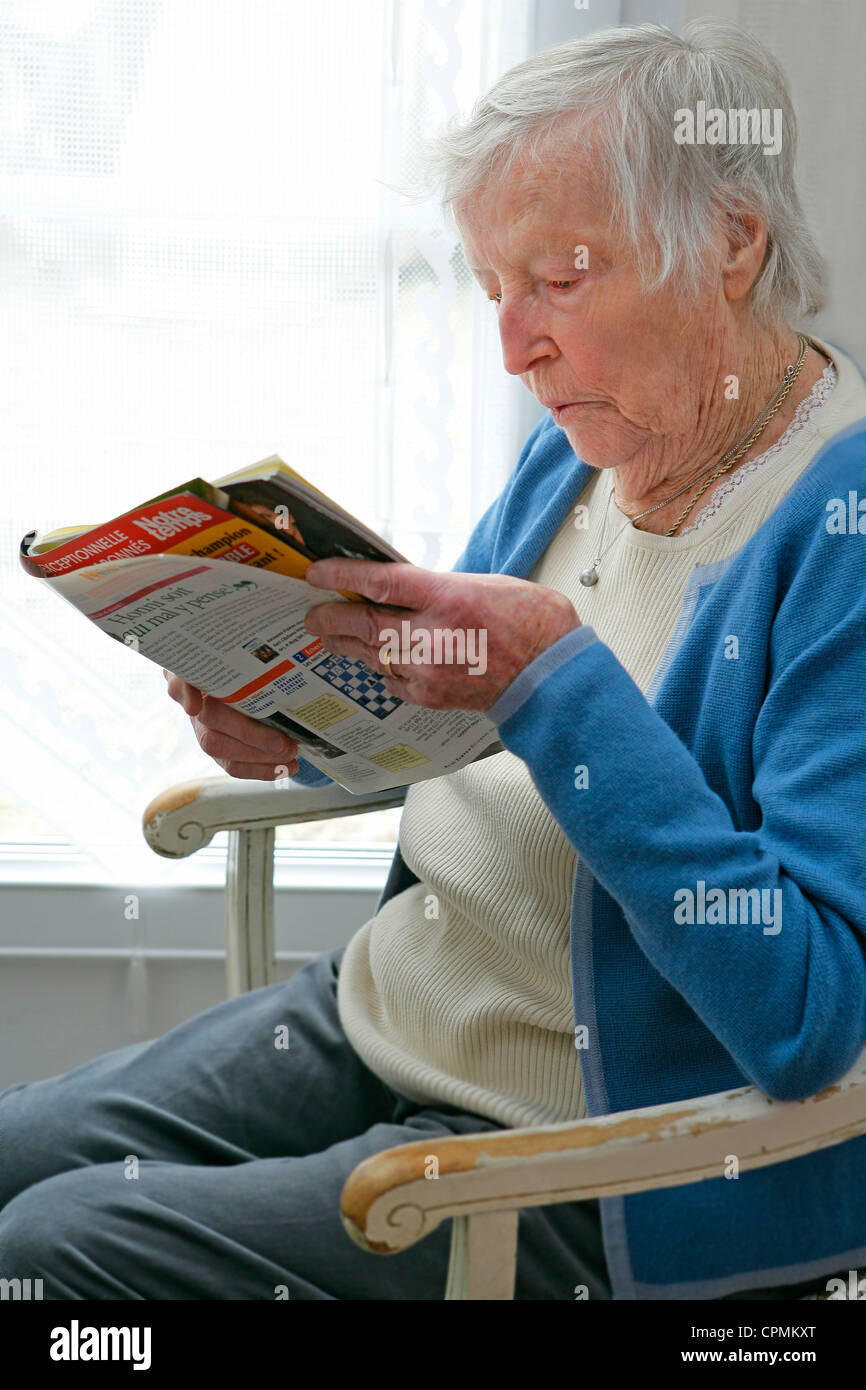 ELDERLY PERSON READING Stock Photo - Alamy
