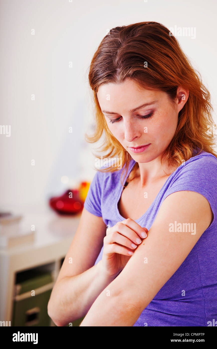 ITCHING IN A WOMAN Stock Photo - Alamy