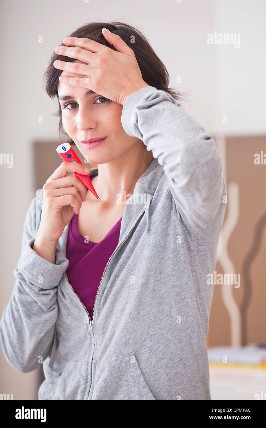 WOMAN WITH FEVER Stock Photo - Alamy