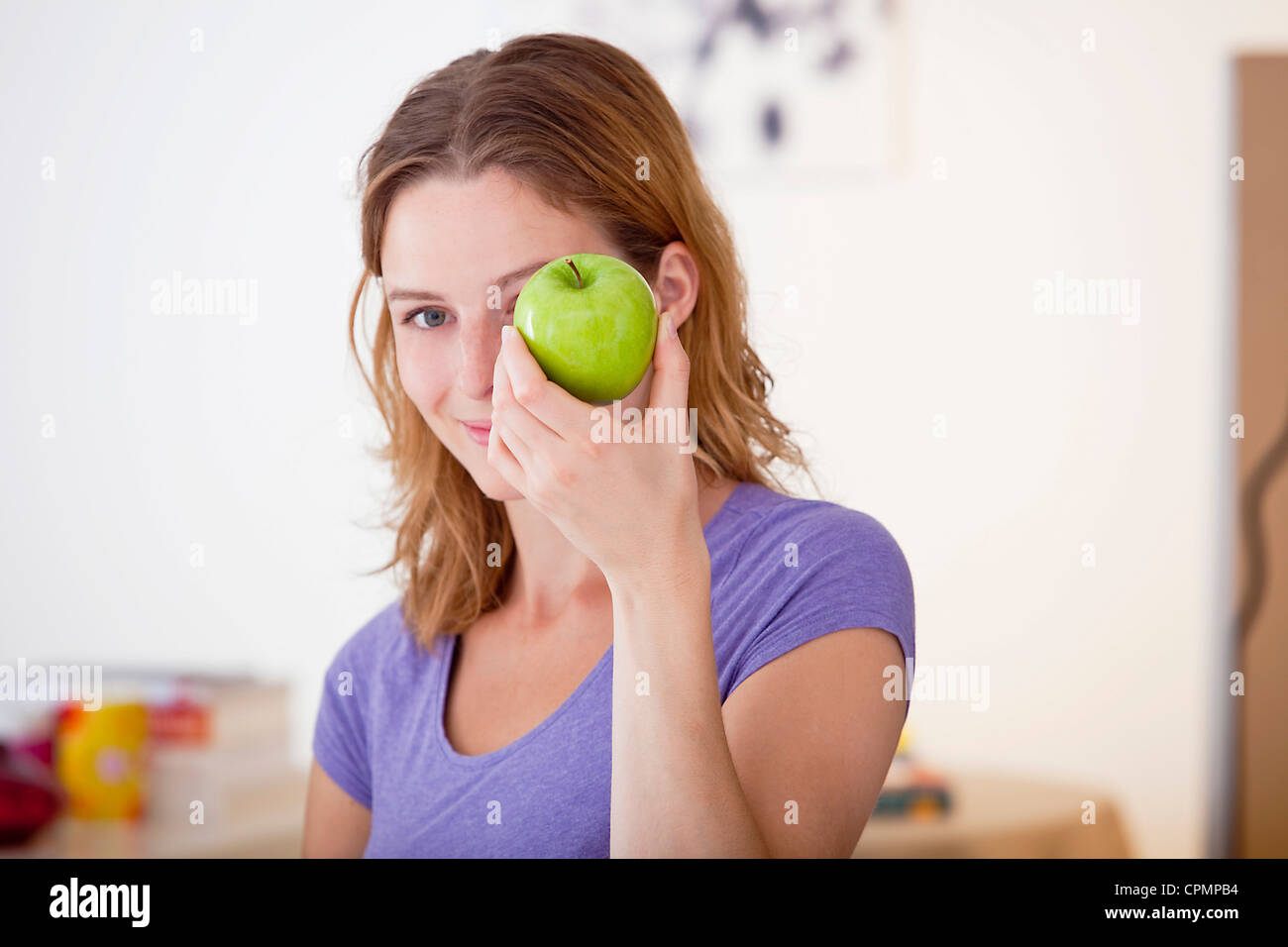 WOMAN EATING FRUIT Stock Photo - Alamy