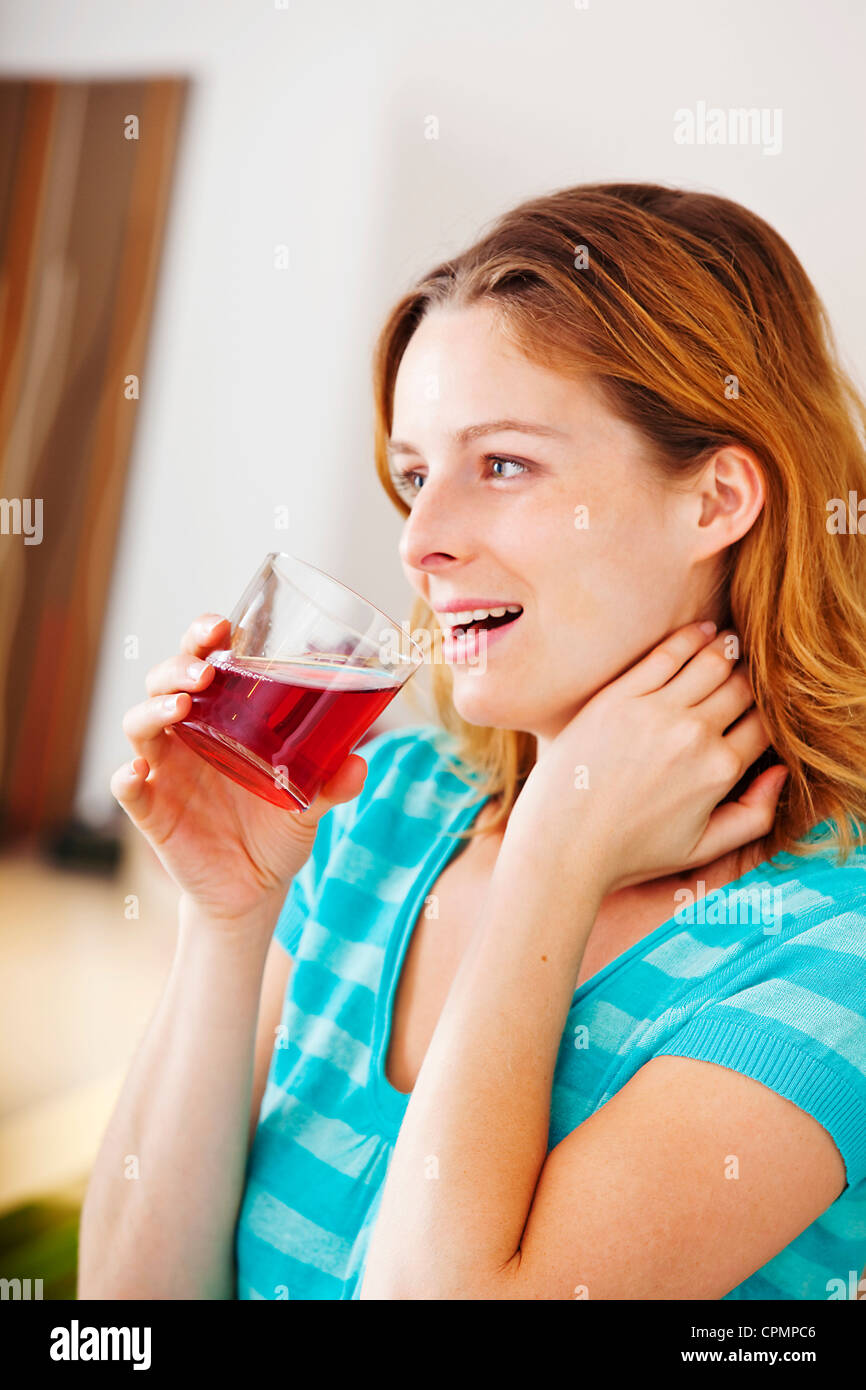 WOMAN WITH COLD DRINK Stock Photo - Alamy
