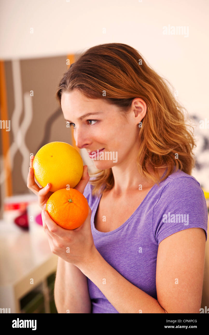 WOMAN EATING FRUIT Stock Photo - Alamy