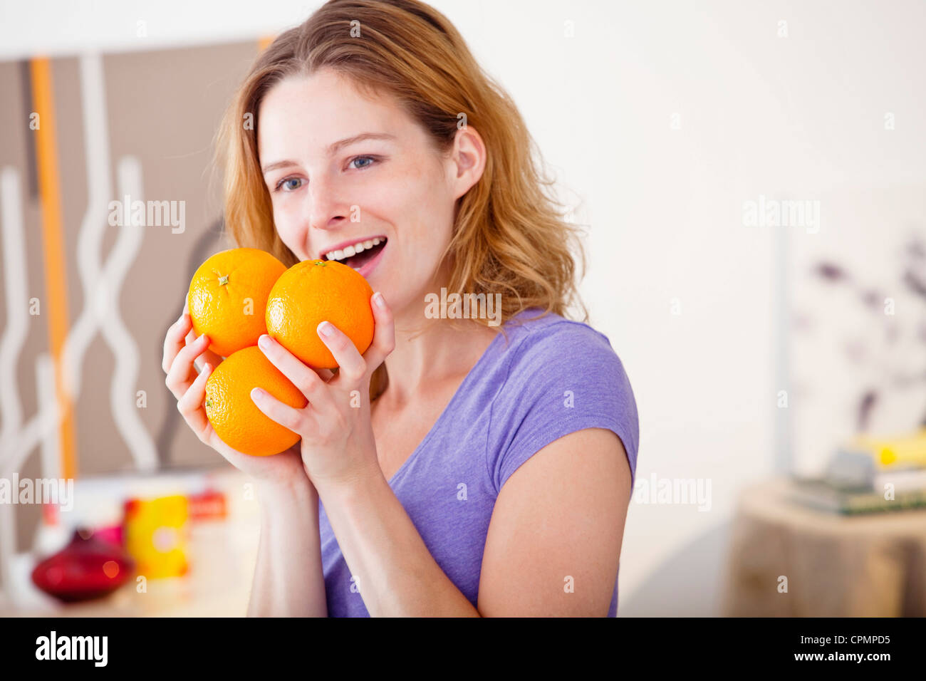 WOMAN EATING FRUIT Stock Photo - Alamy