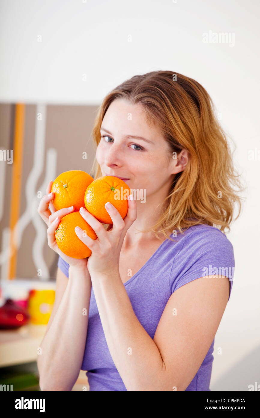 WOMAN EATING FRUIT Stock Photo - Alamy