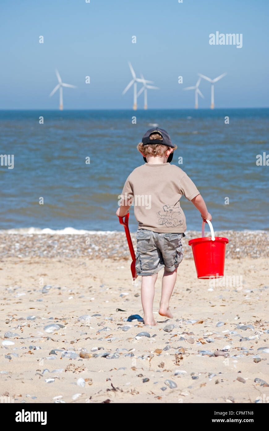 Boy walking with bucket hi-res stock photography and images - Alamy