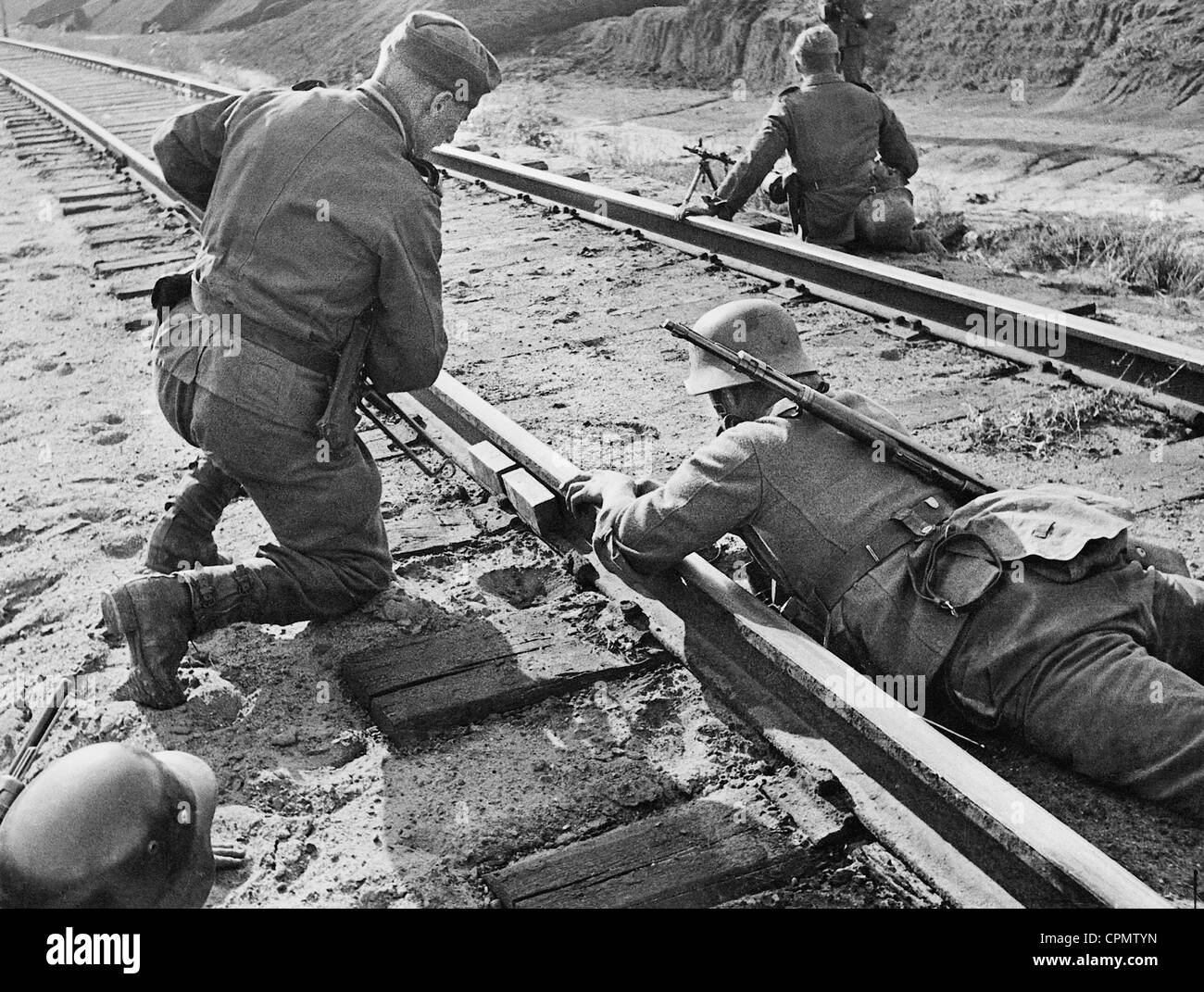 German engineers remove an explosive charge from railway tracks Stock ...