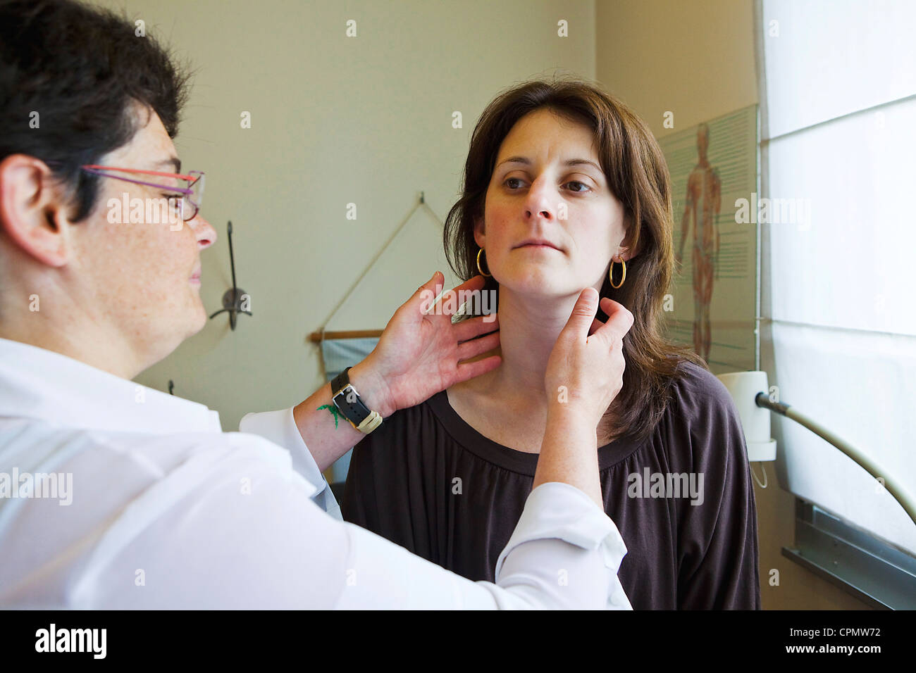 WOMAN PALPATING LYMPH NODE Stock Photo - Alamy