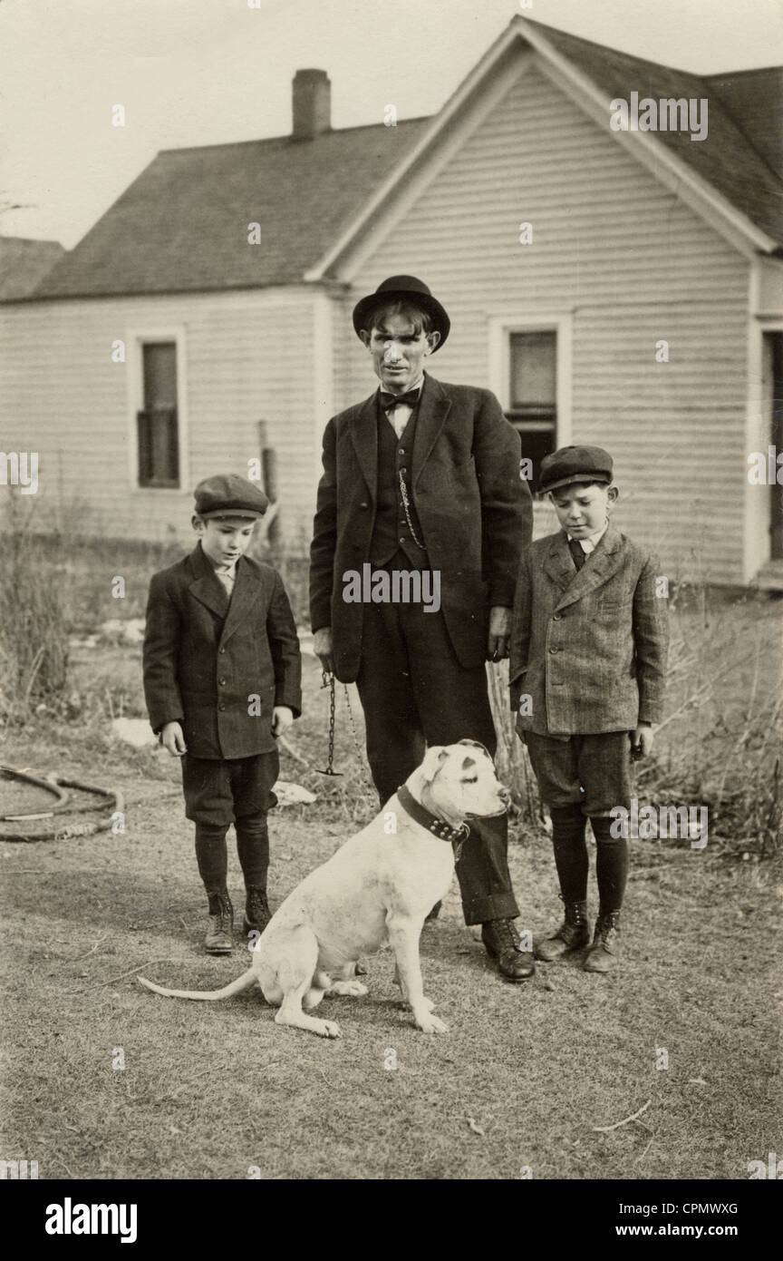 Father & Two Sons with White Pit Bull Stock Photo - Alamy