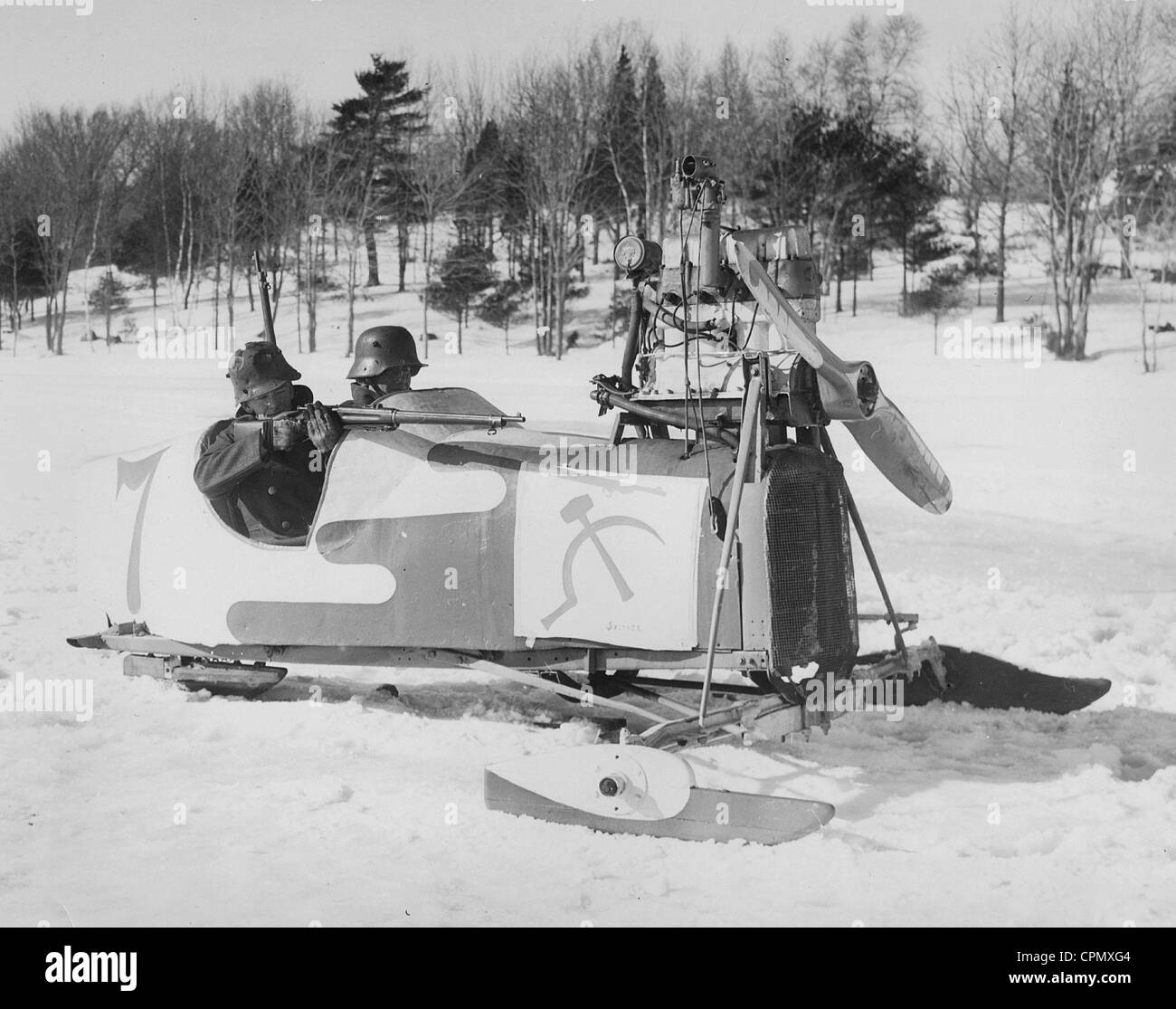 American National Guardsmen try out a motorized sled, 1940 Stock Photo ...