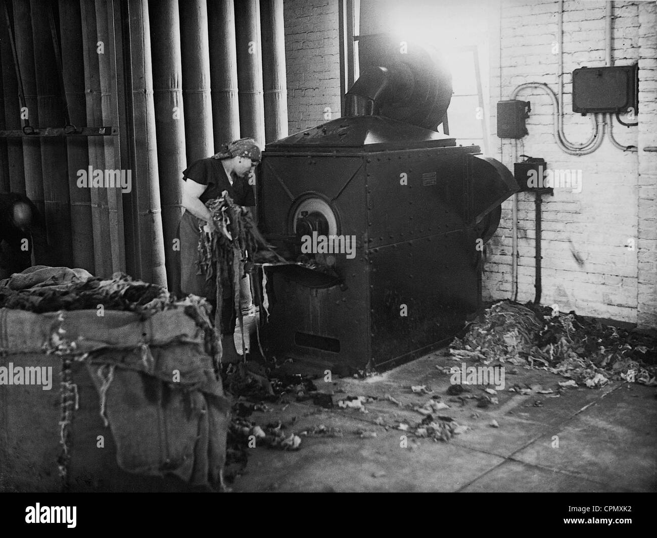 Recycling old clothes, 1940 Stock Photo - Alamy