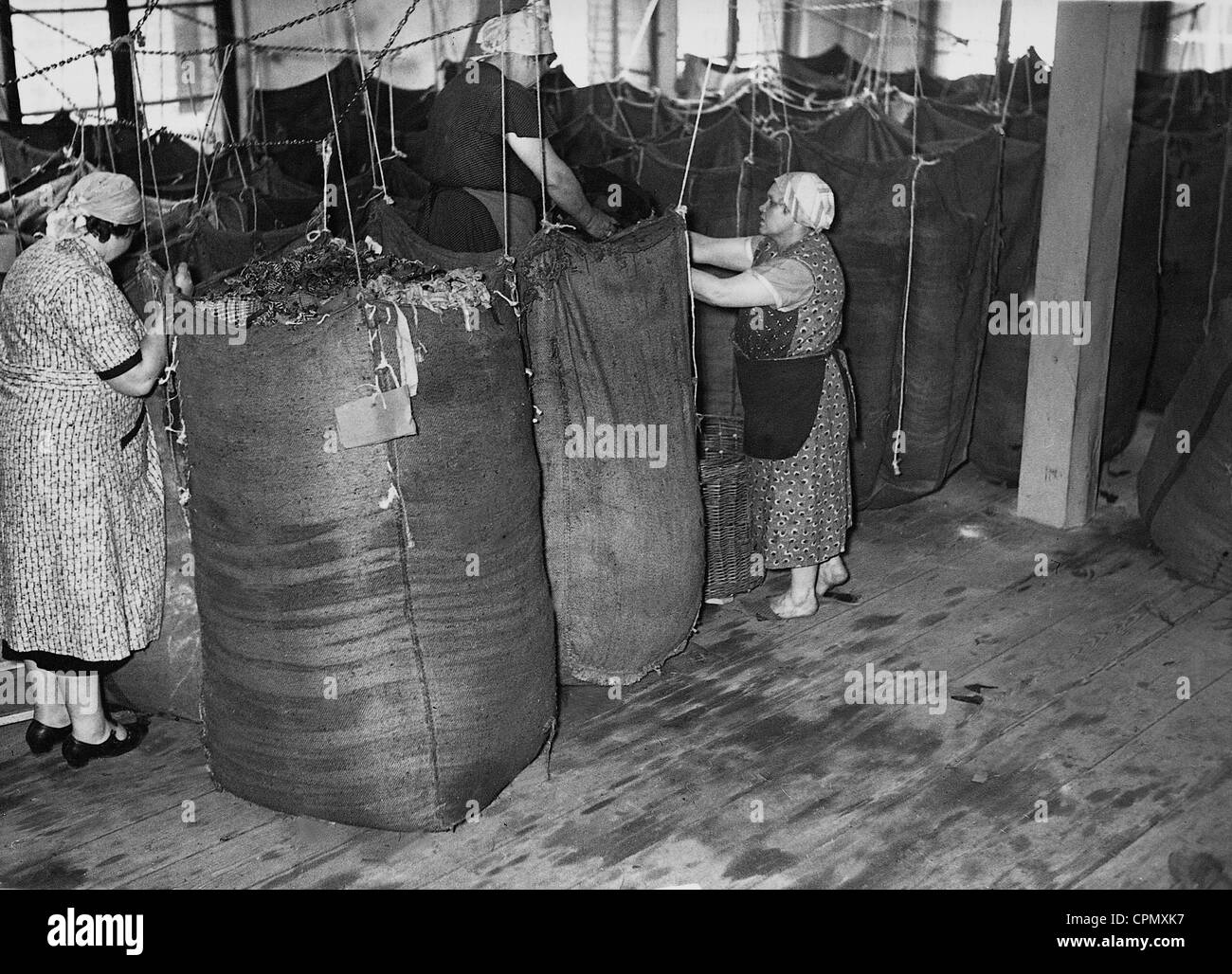 Recycling old clothes, 1940 Stock Photo - Alamy