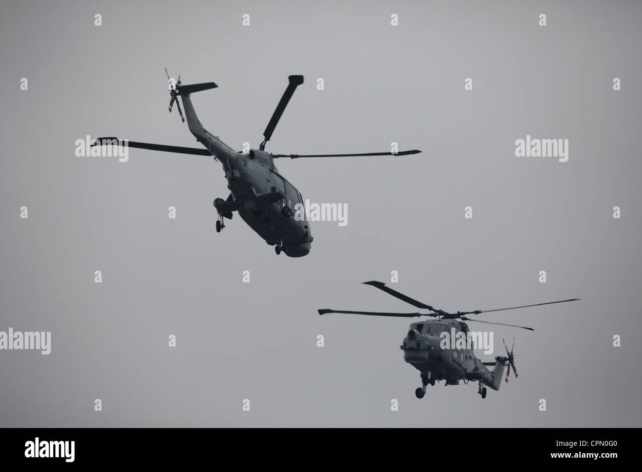 Two Lynx military helicopters perform manoeuvres Stock Photo - Alamy