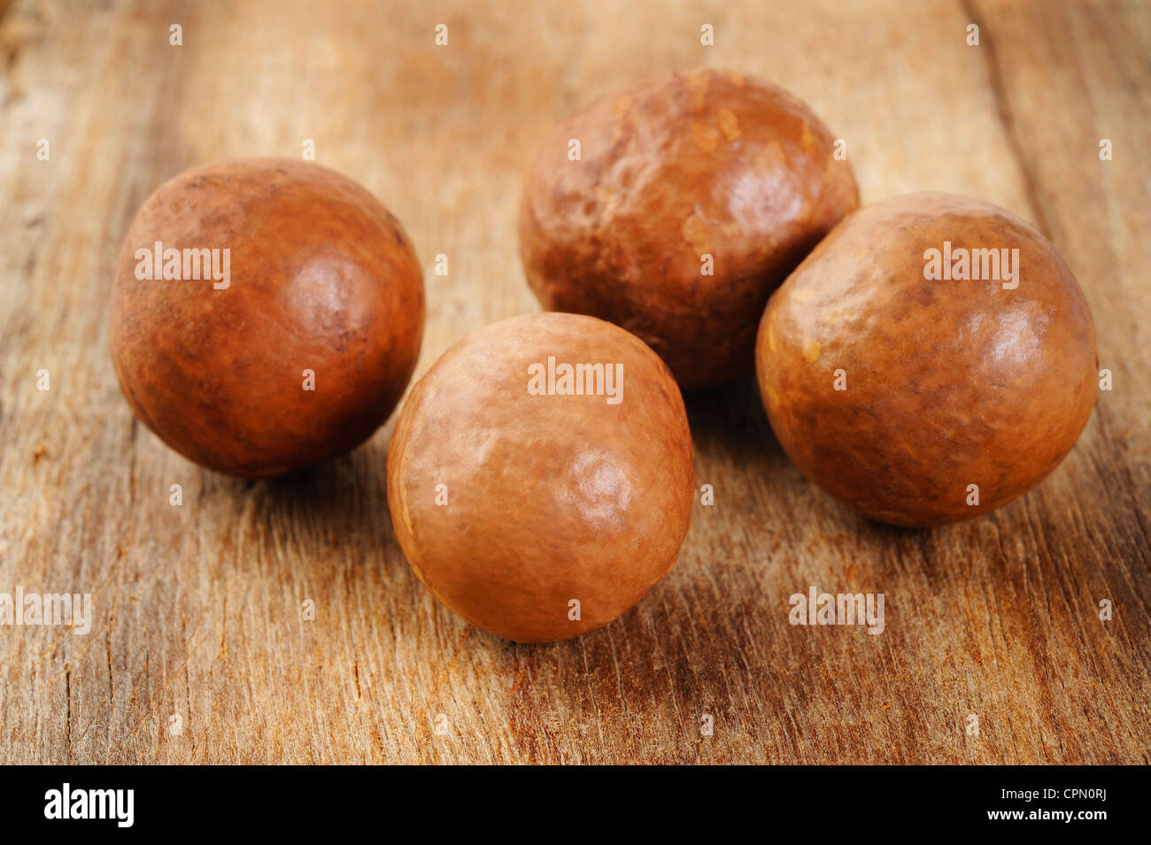 macadamia on wood background Stock Photo - Alamy