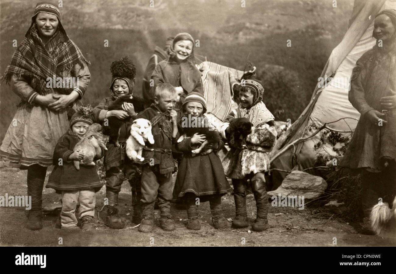 Laplander Women & Children with Cuddly Puppies Stock Photo - Alamy