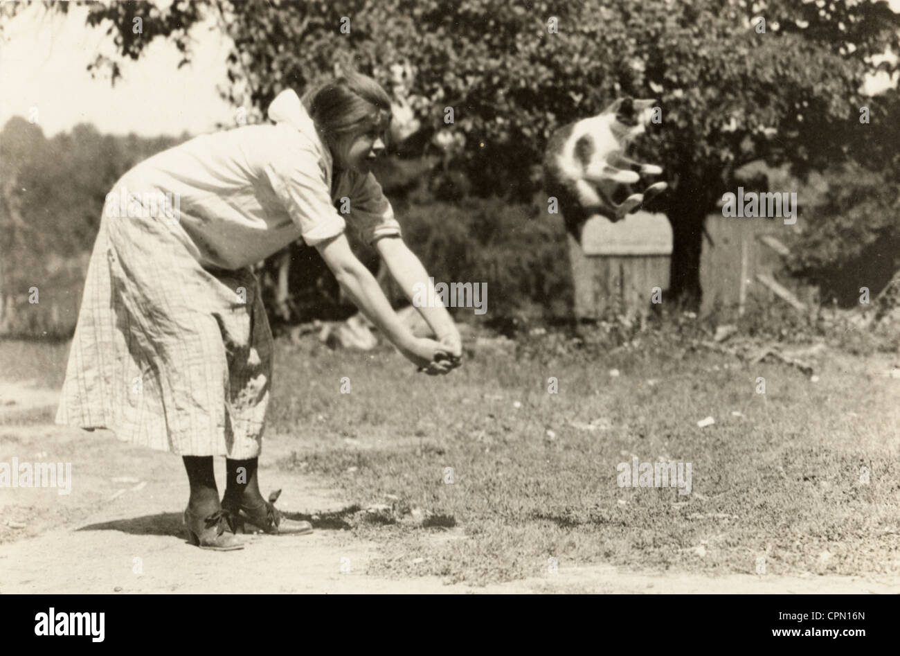 Girl Playing Illicit Game of Cat Toss Stock Photo - Alamy