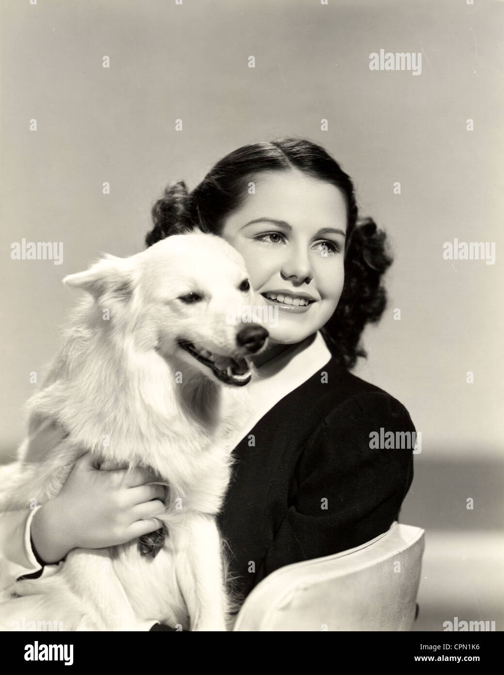 Beautiful Young Model with Pure White Dog Stock Photo - Alamy