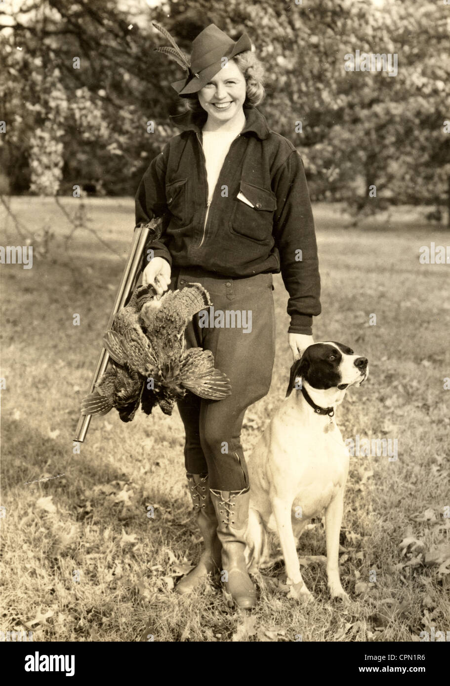 Confident Woman Hunter with Pheasant & Hunting Dog Stock Photo - Alamy