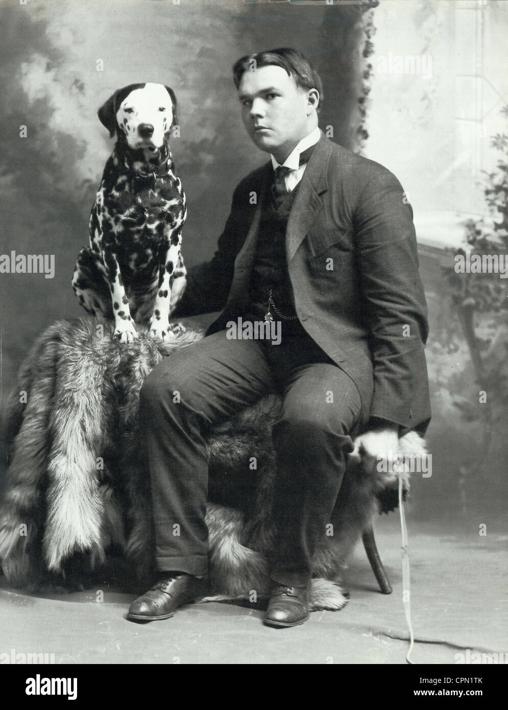 Heavy Set Prosperous Young Man & Dalmatian Dog Stock Photo - Alamy