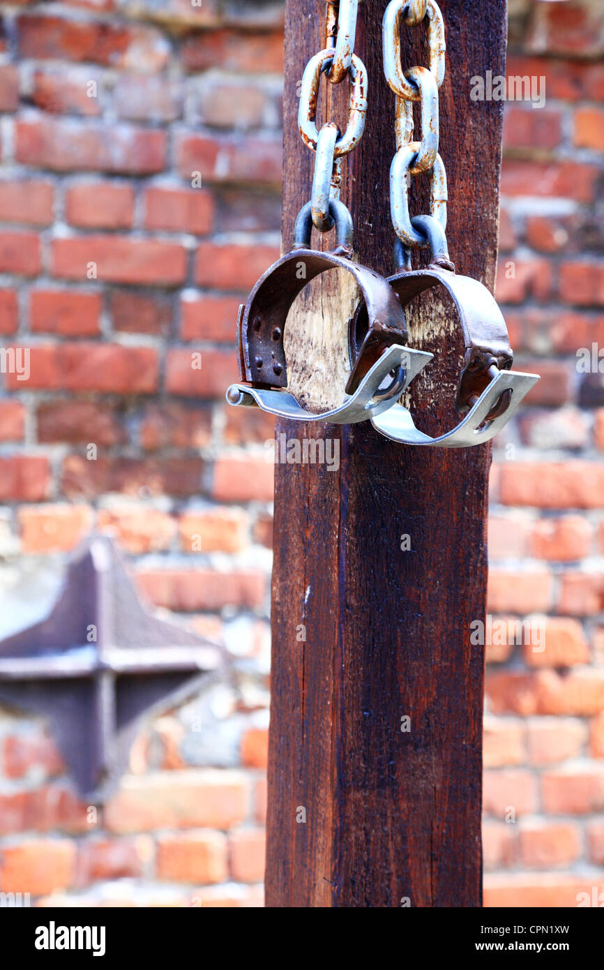 old fetters, manacles brick two old rusted iron rings on wall ...