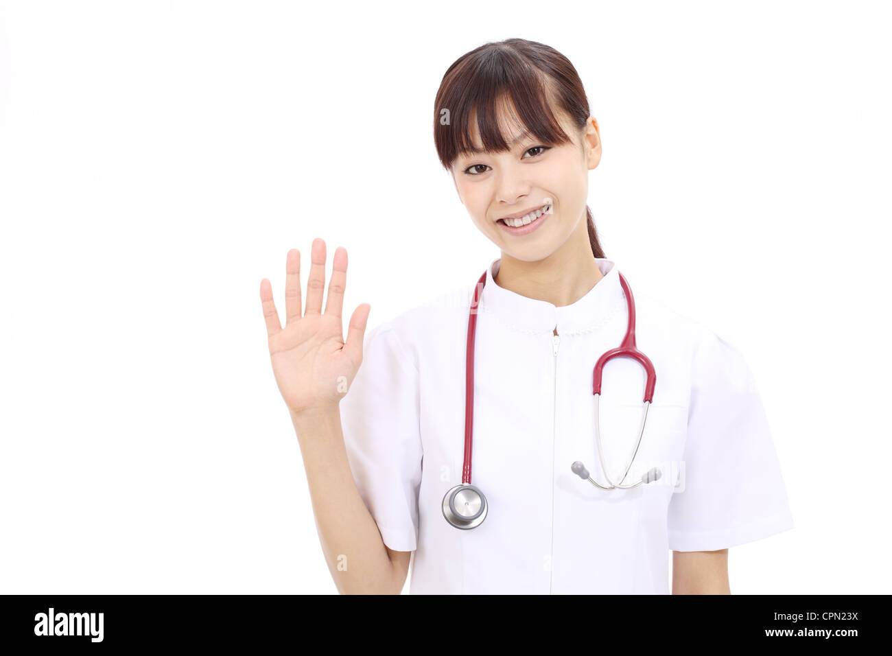 Young asian female nurse with bye bye gesture Stock Photo - Alamy