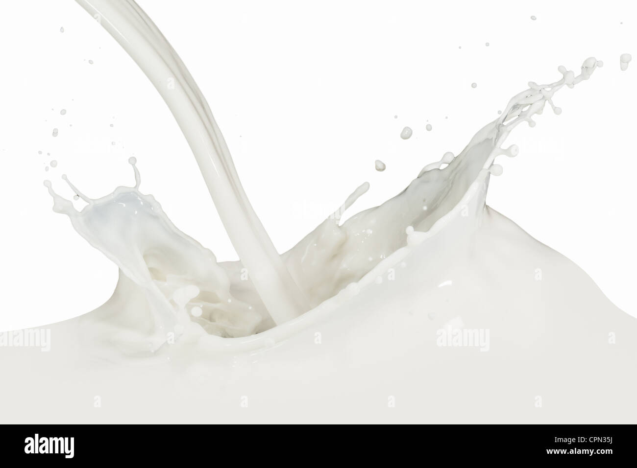 splashing milk isolated on white background Stock Photo - Alamy