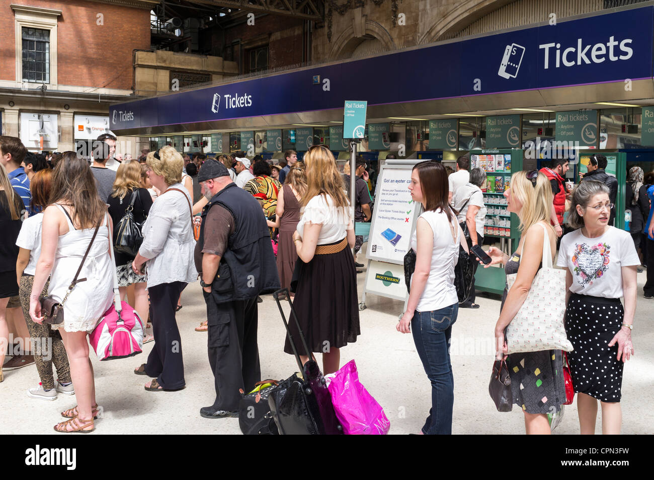Long queues for Train tickets at London's Victoria Station Stock Photo ...