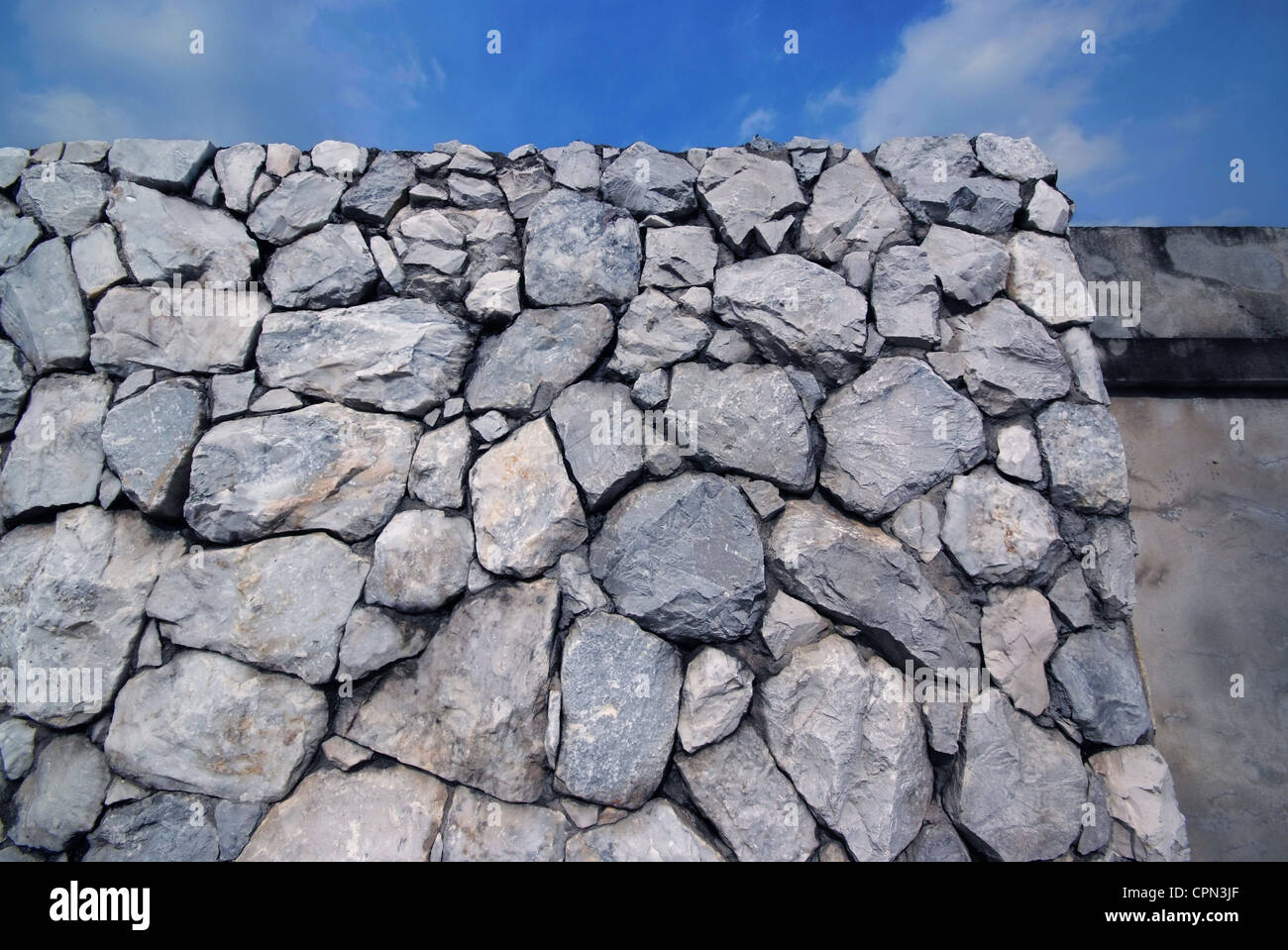 Sky and Stone wall background Stock Photo - Alamy