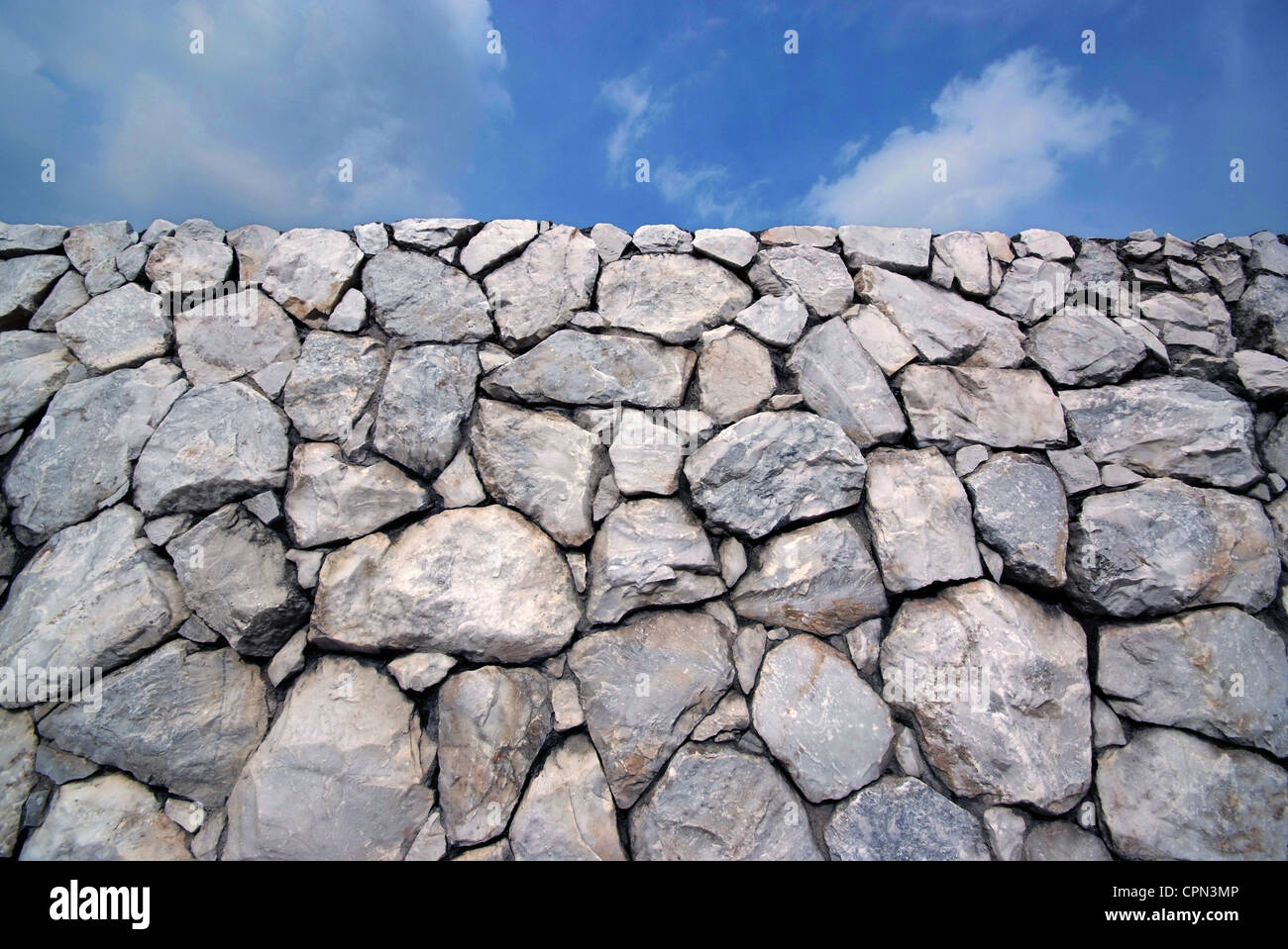 Sky and Stone wall background Stock Photo - Alamy